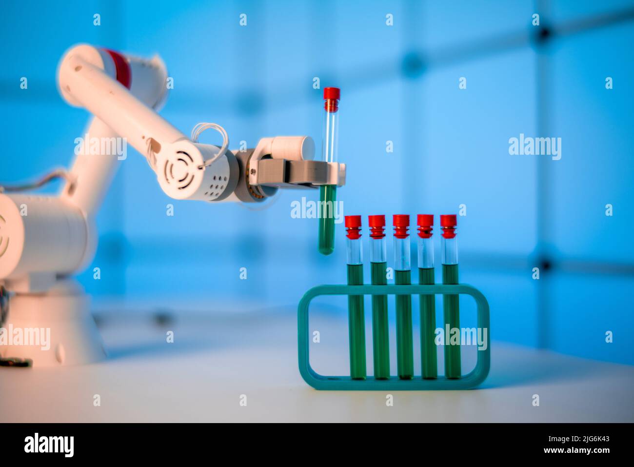 Robot take a test tube with a liquid from Test tube rack in a ...