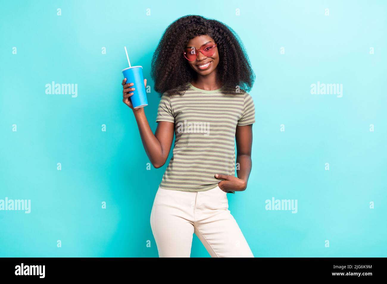 Photo of cheerful charming lady hold soda drink cup toothy smile ...