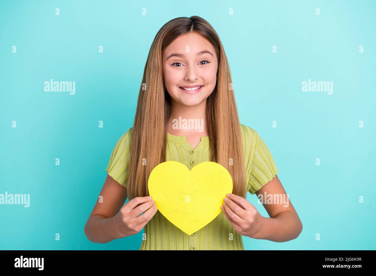 Portrait of cheerful nice girl hands hold paper heart symbol card ...