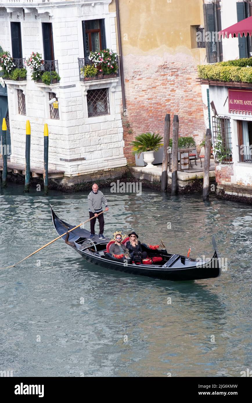An Attractive Young Couple Take A Ride On The Grand Canal In A Gondola