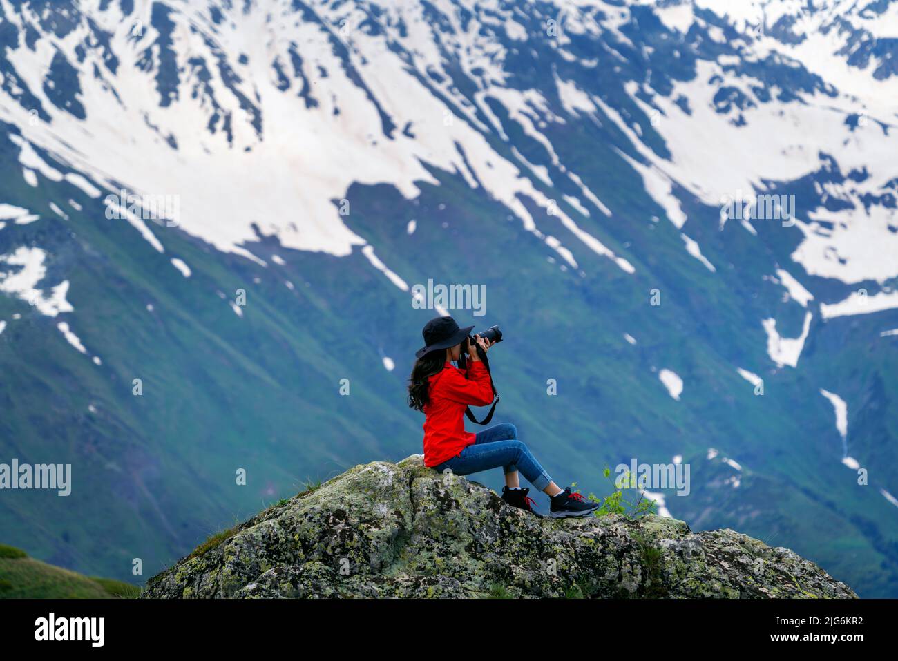 Tourist take a photo at snow mountains in Mestia, Georgia Stock Photo ...