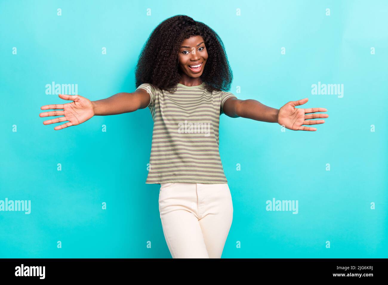 Photo of shiny friendly lady wear striped t-shirt smiling open arms ...