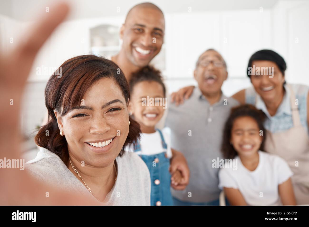 Immortalizing your smiles in my memory. Shot of a family taking selfies ...