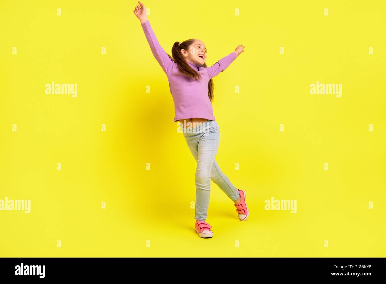 Full length photo of positive cheerful school kid dancing energetic ...