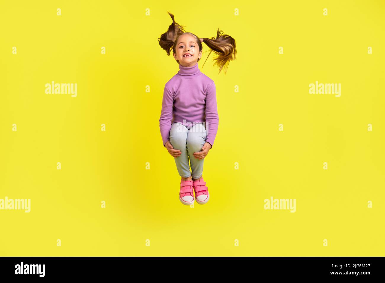 Full size photo of lovely pretty kid girl jumping high isolated vivid ...