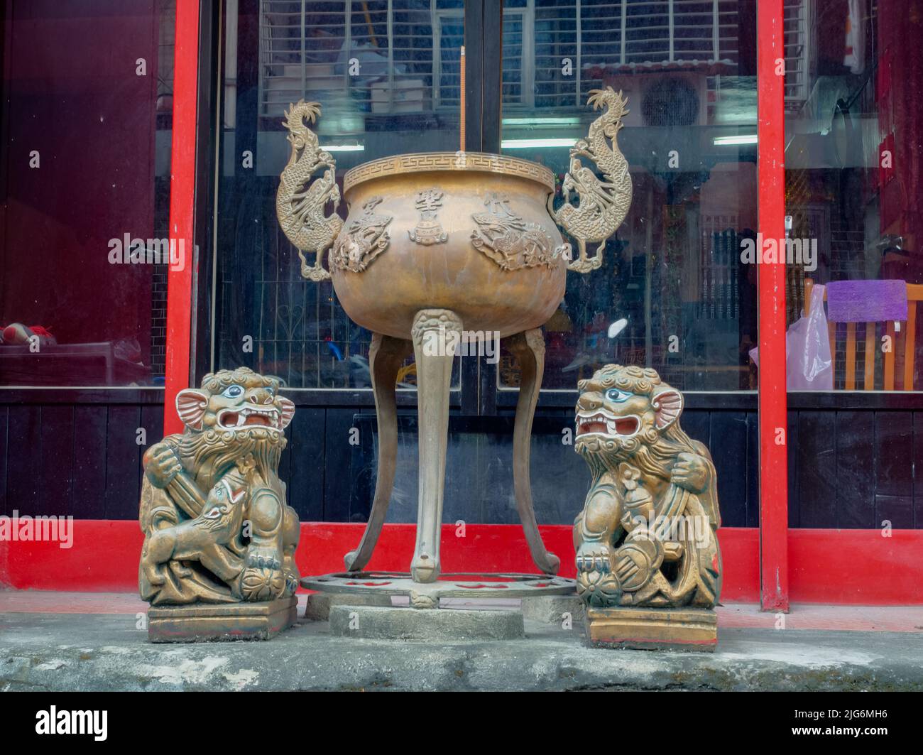 Taipei, Taiwan - October 2016: Golden censer in front of a small chapel ...