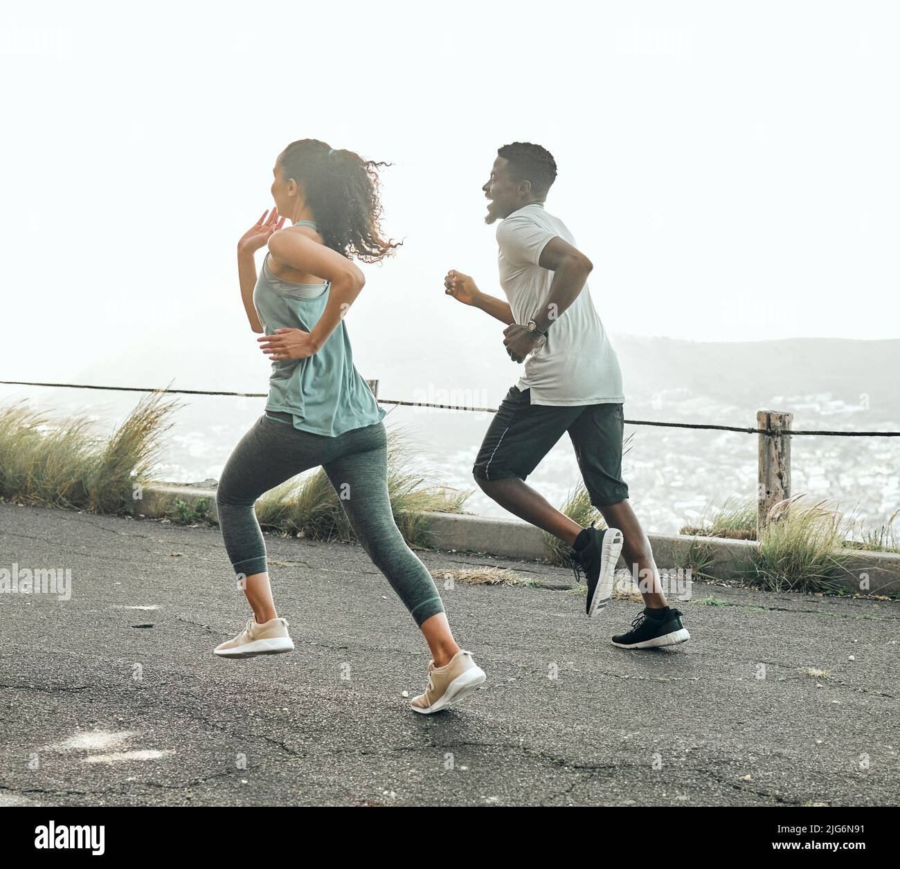 The road never judges you. Shot of two friends running together Stock ...