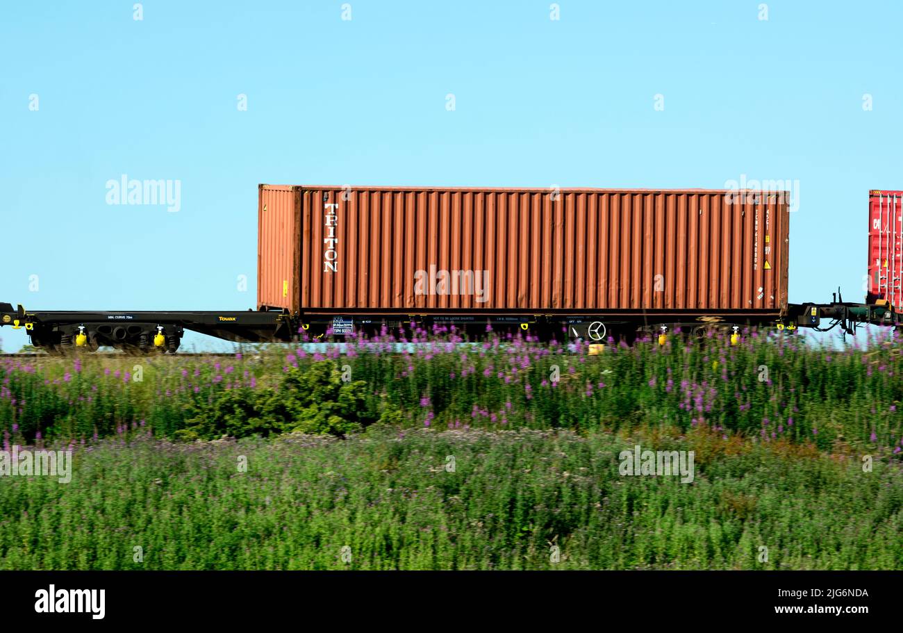 Triton shipping container on a freightliner train, Warwickshire, UK ...