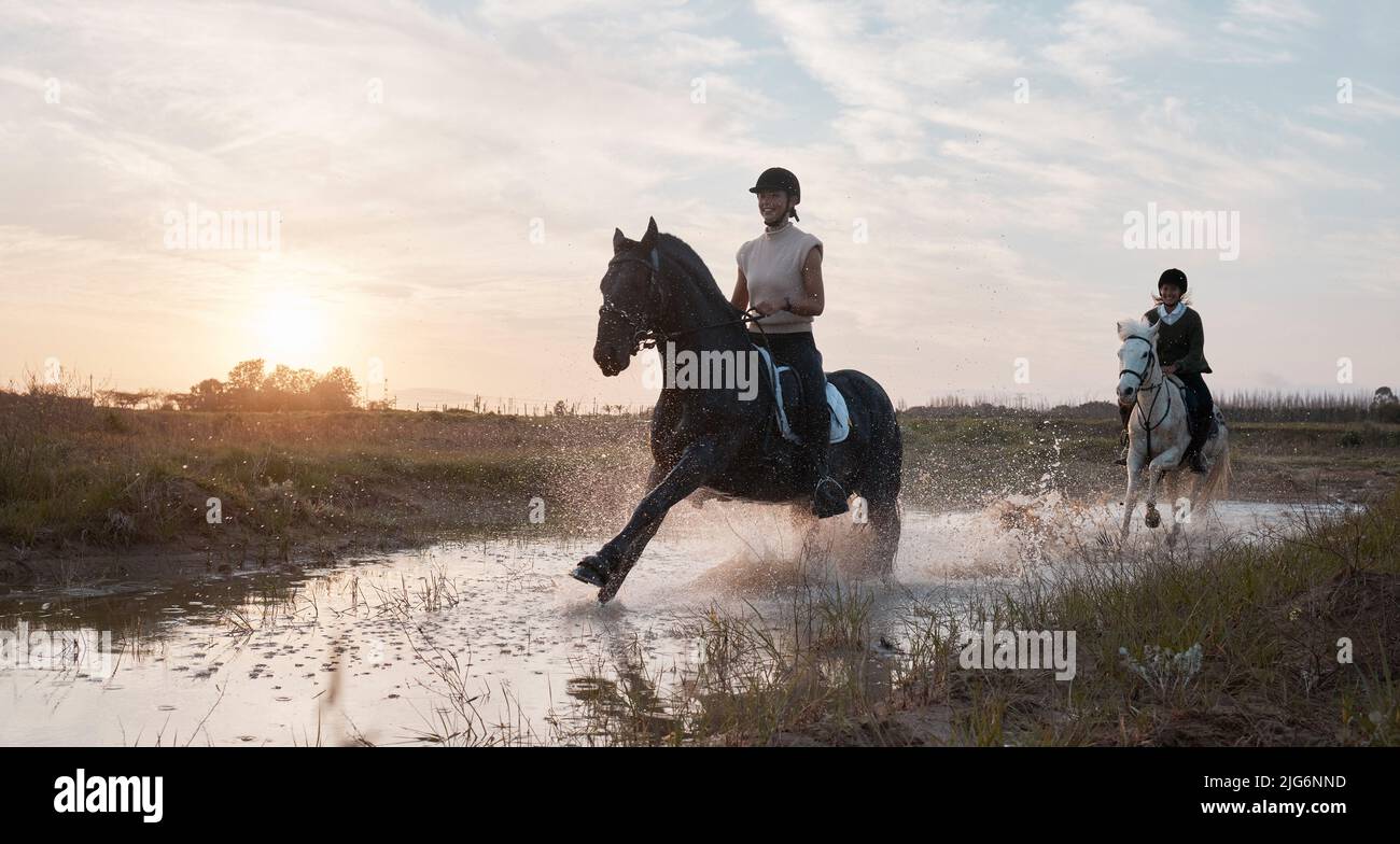 Its always a good day when were out horse riding. Shot of two young ...