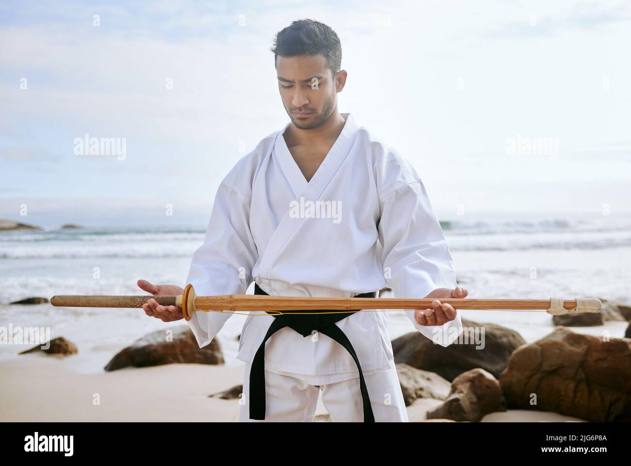 Warriors are always ready for anything. Shot of a young martial artist ...