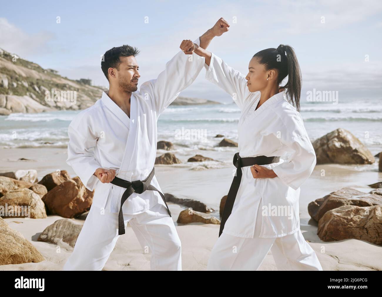 Packing power into their punches. Shot of two young martial artists ...