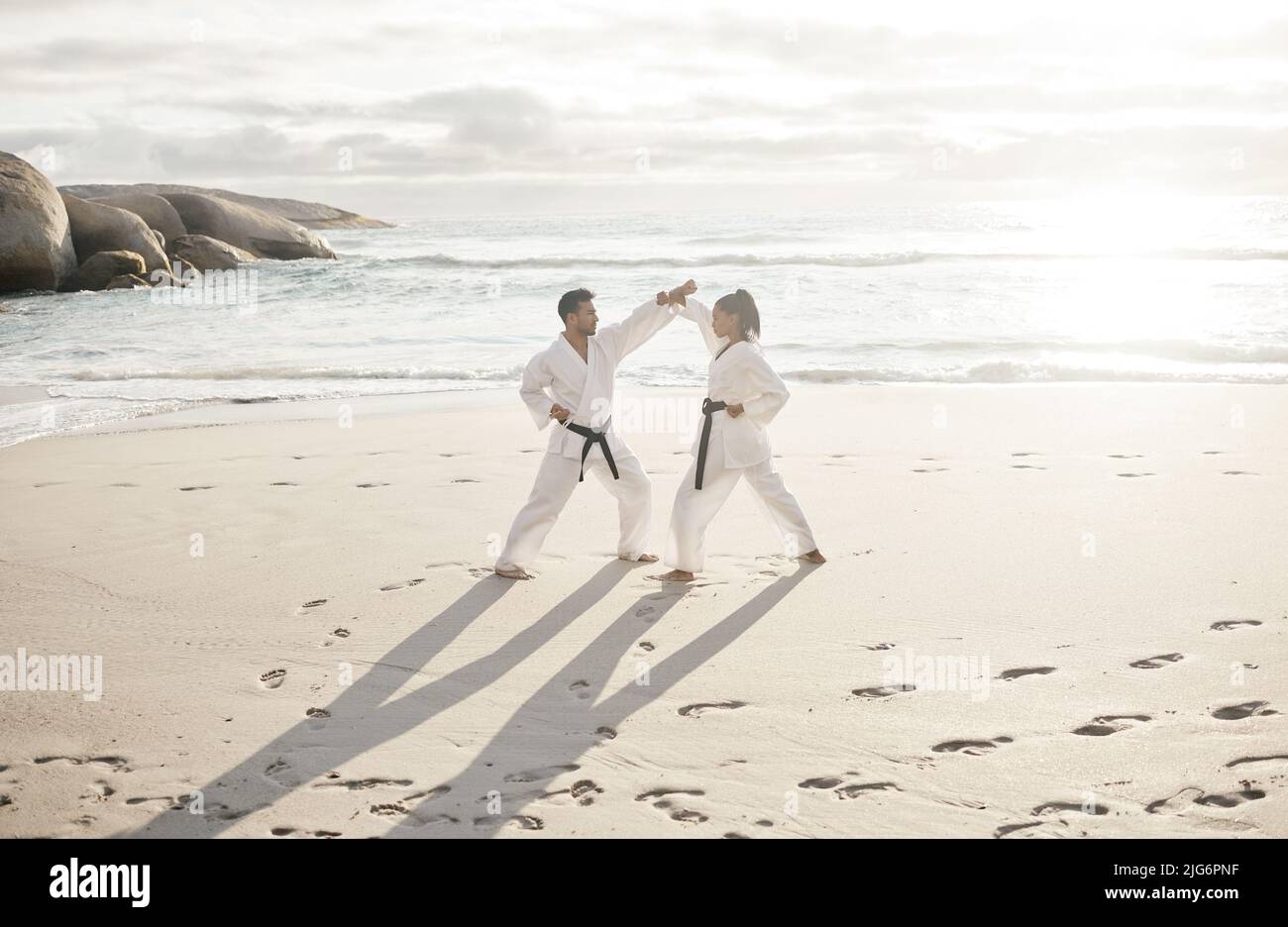 Wax on, was off. Full length shot of two young martial artists ...