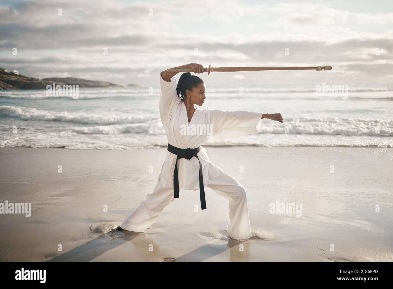 Shes a professional stick fighter. Full length shot of an attractove ...