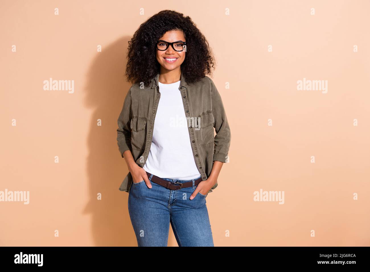 Photo of young african woman confident eyewear manager hands in pocket ...