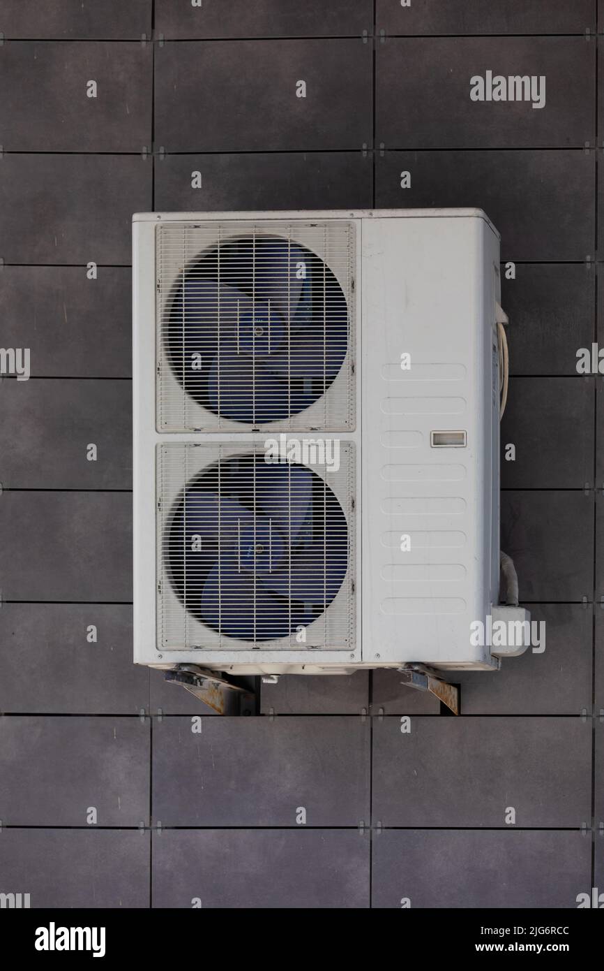 air conditioning unit Central split system hanging outside the building ...