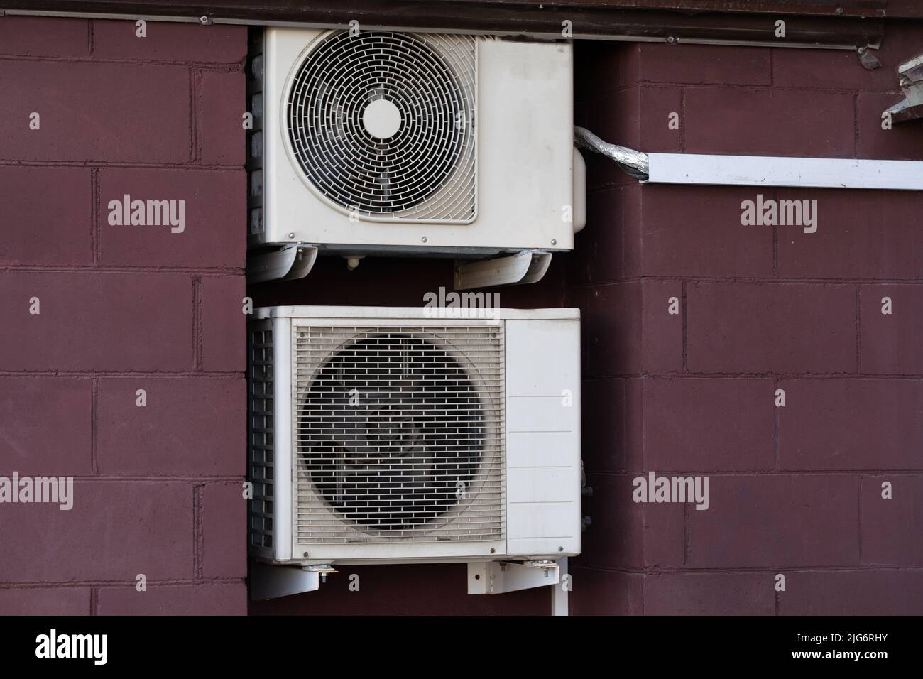 air conditioning unit Central split system hanging outside the building ...