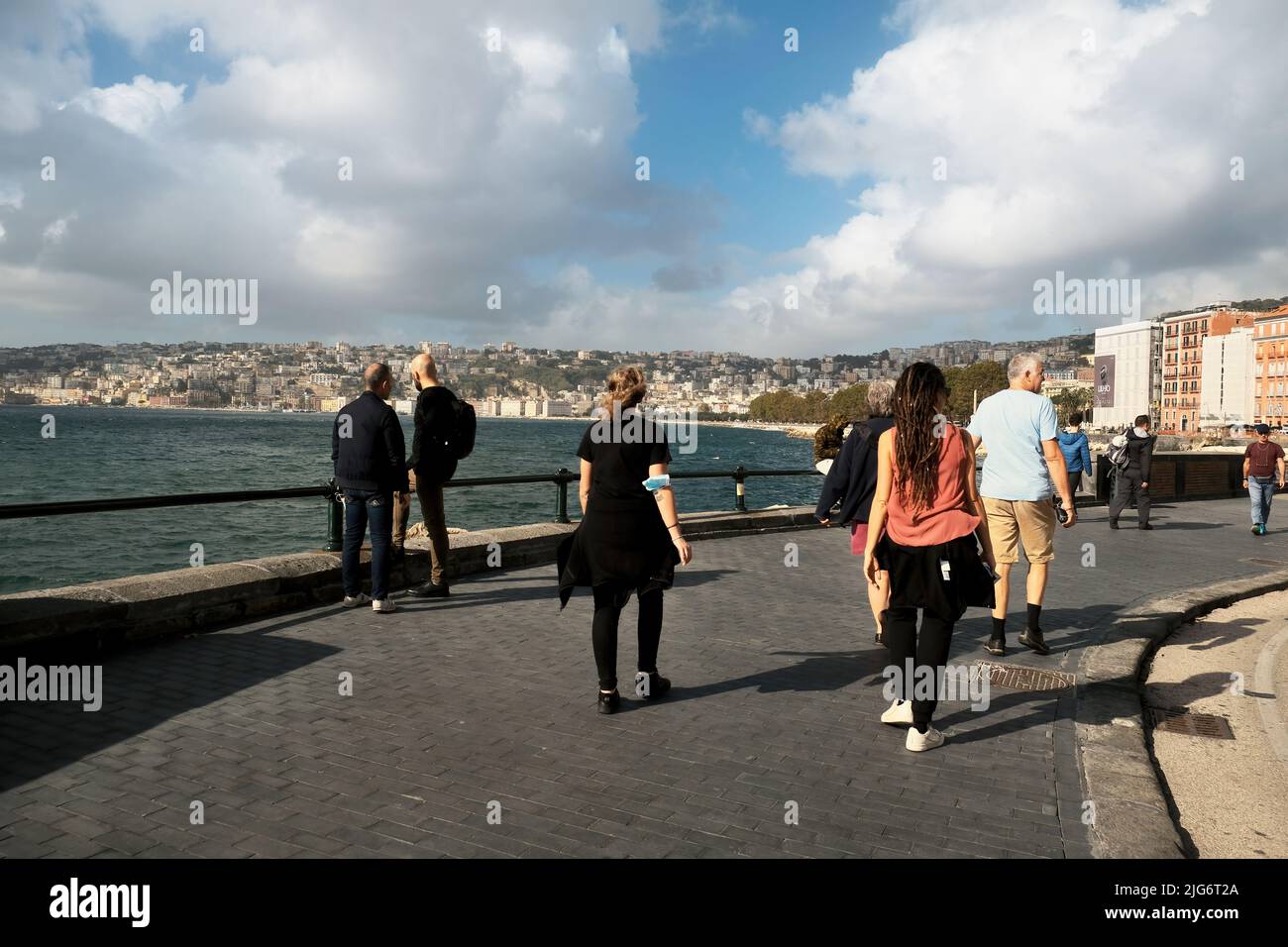 Naples, Italy - November 2, 2021. People relaxing on the Via Caracciolo ...