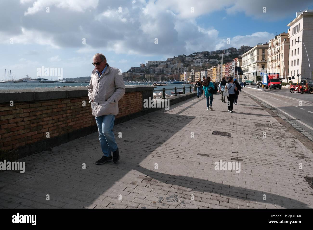 Naples, Italy - November 2, 2021. People relaxing on the Via Caracciolo ...