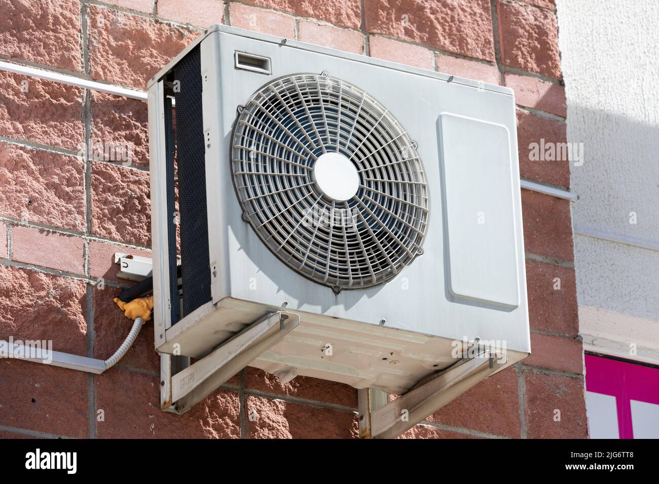 air conditioning unit Central split system hanging outside the building ...
