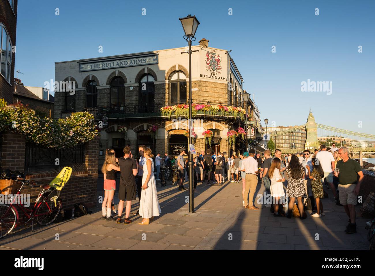 People relaxing and having a drink outside The Rutland Arms public house, Lower Mall ...