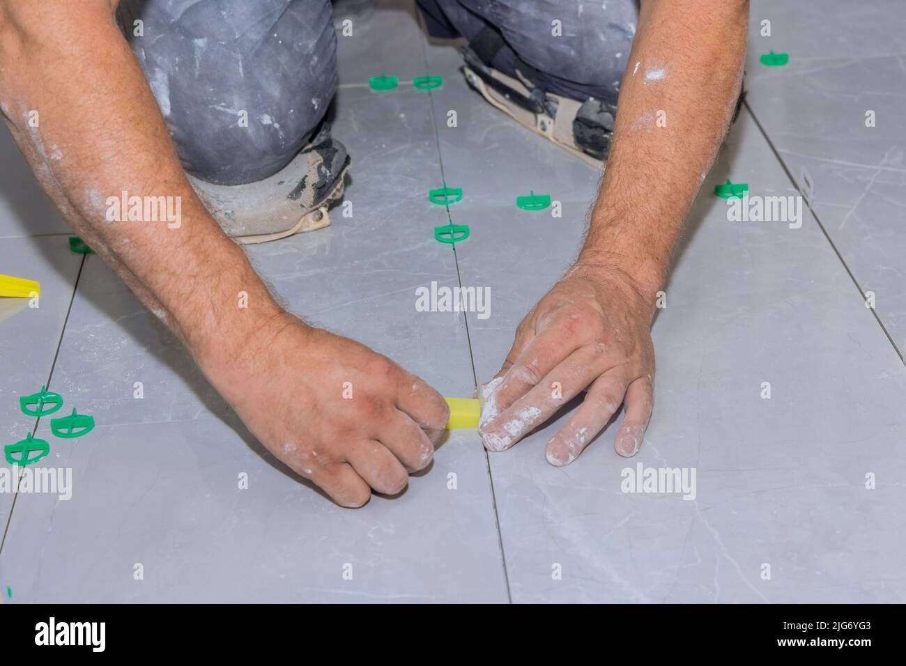 Bathroom tile leveling system with plastic clips and wedges Stock Photo ...