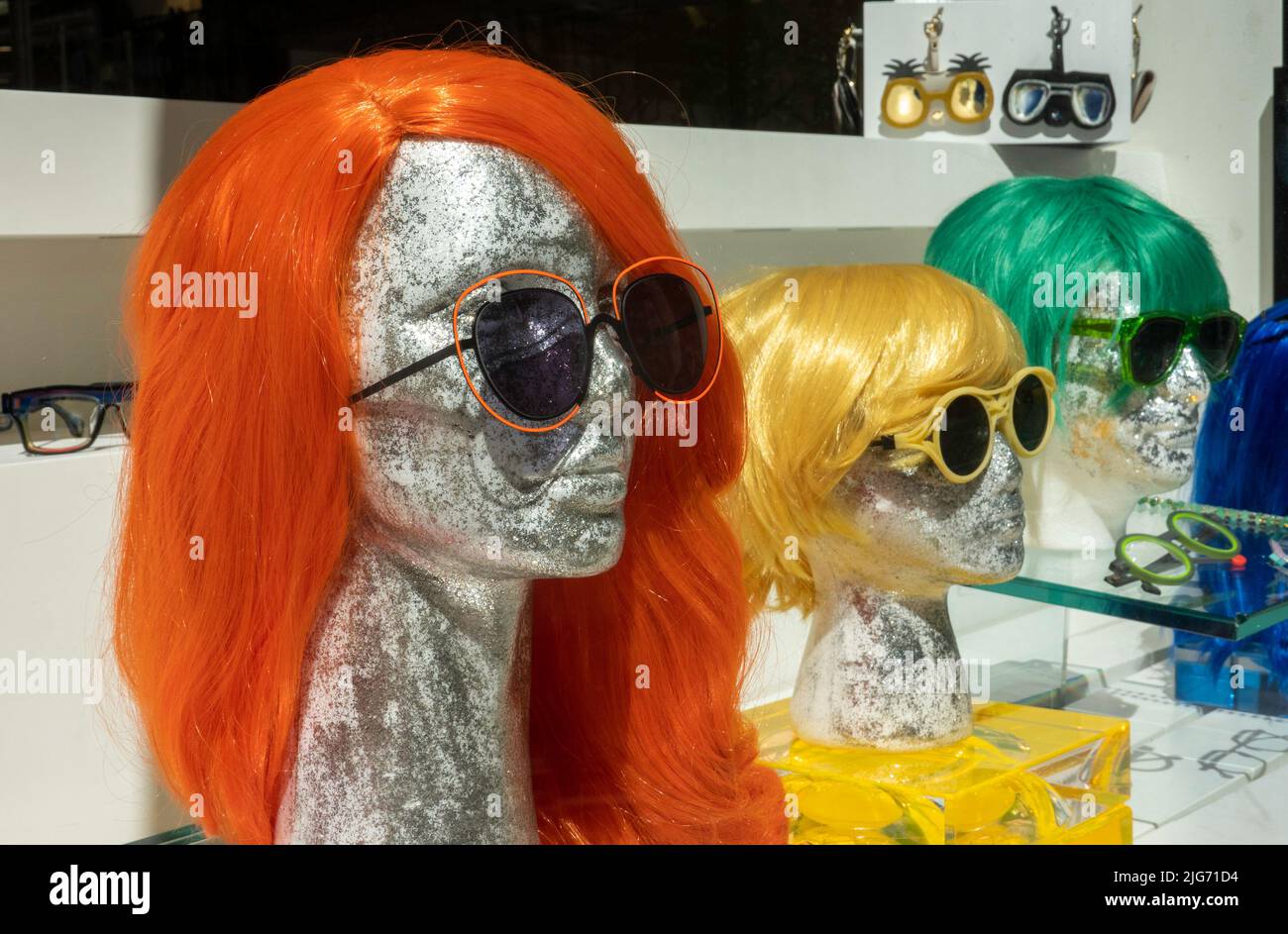 Rainbow color mannequins with wigs and sunglasses during June Pride ...