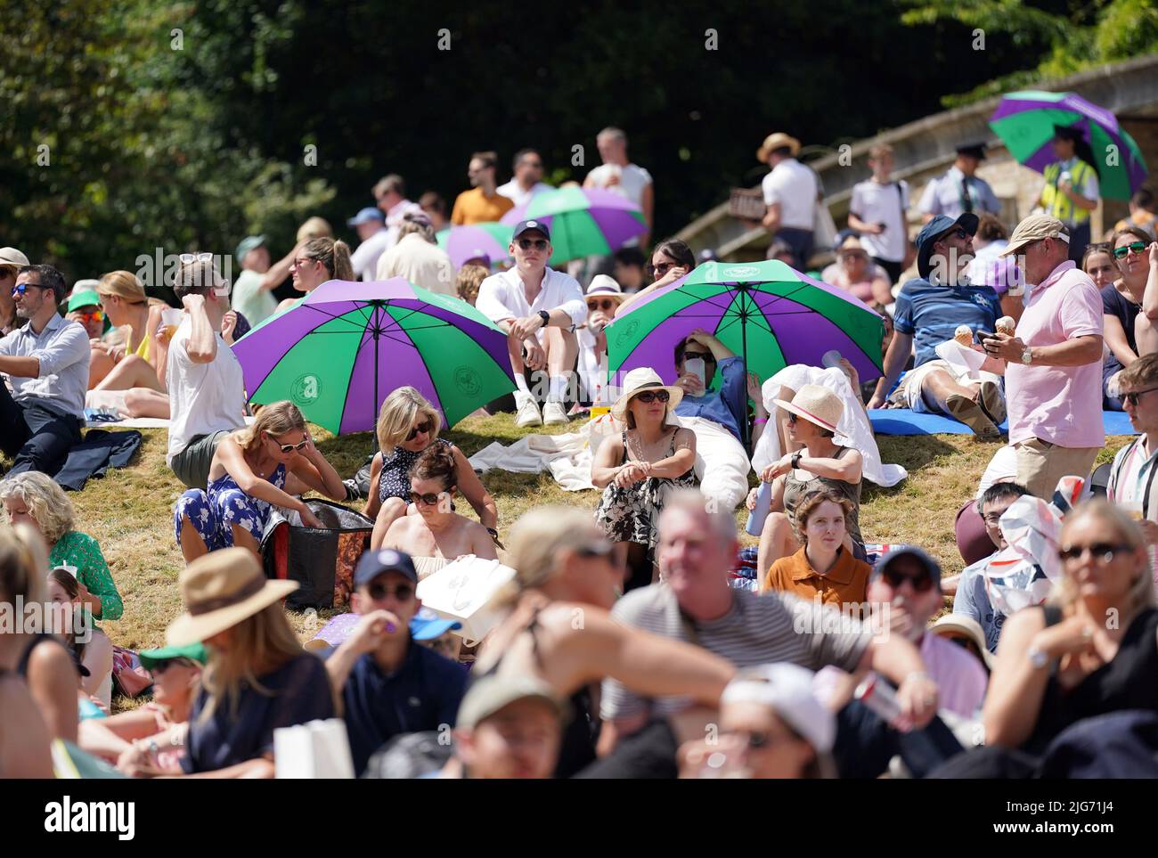 Spectators shield from sun hi-res stock photography and images - Alamy