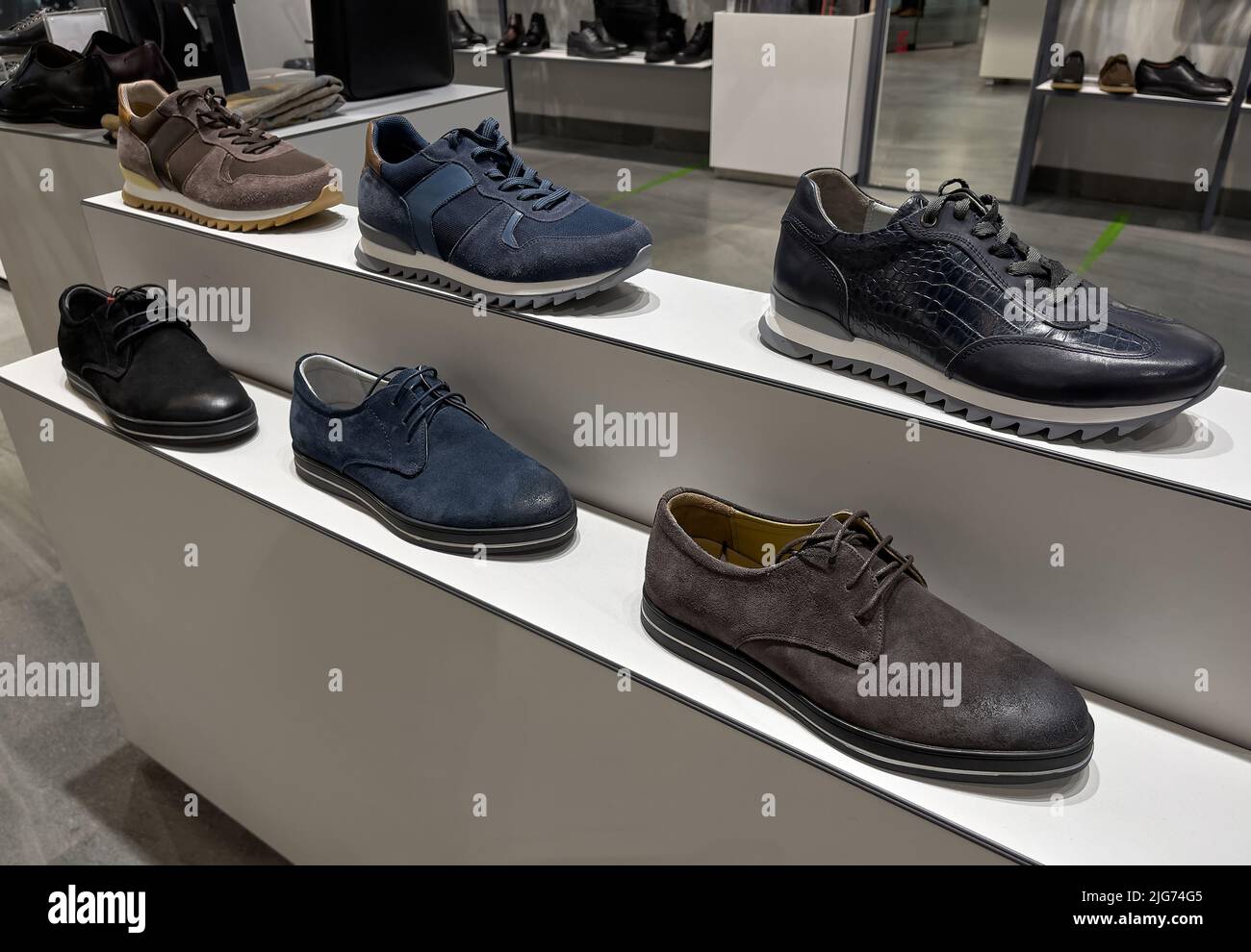 Shoes for men on a display stand in a store Stock Photo - Alamy