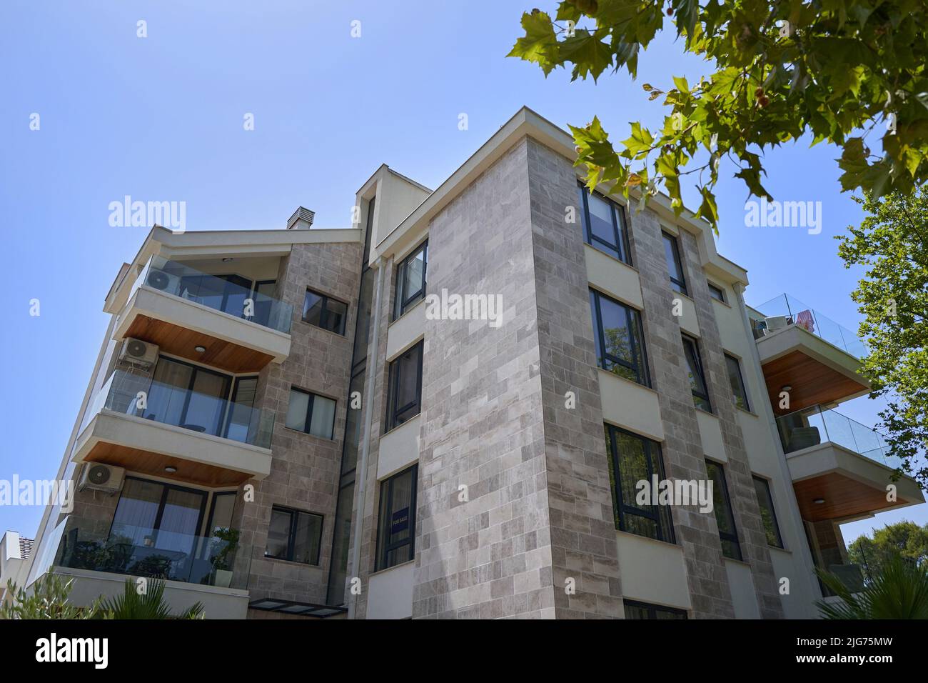 Compact modern apartment building against the blue sky Stock Photo - Alamy
