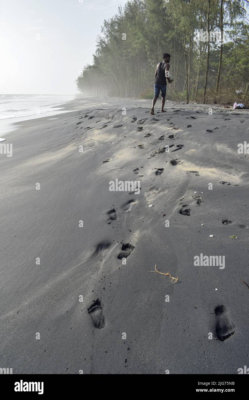 Footmarks of a man who is walking at beach Stock Photo - Alamy