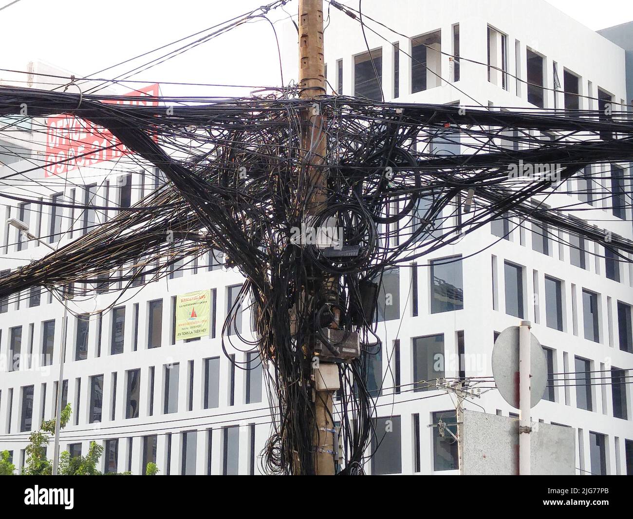 An electric pole supports a series of entangled electrical systems ...