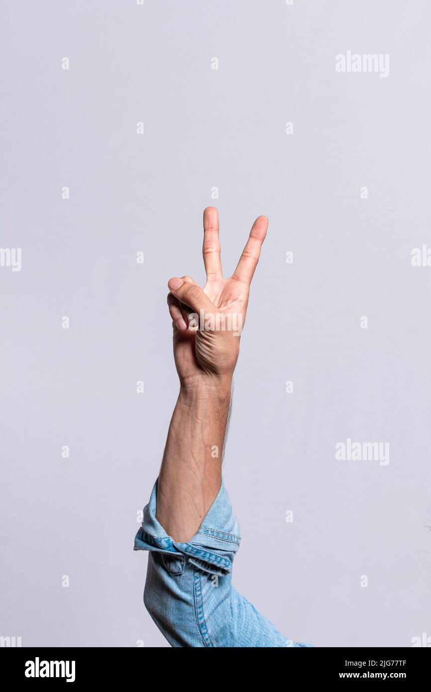 Hand counting number two, Man hand showing number two, Guy finger ...