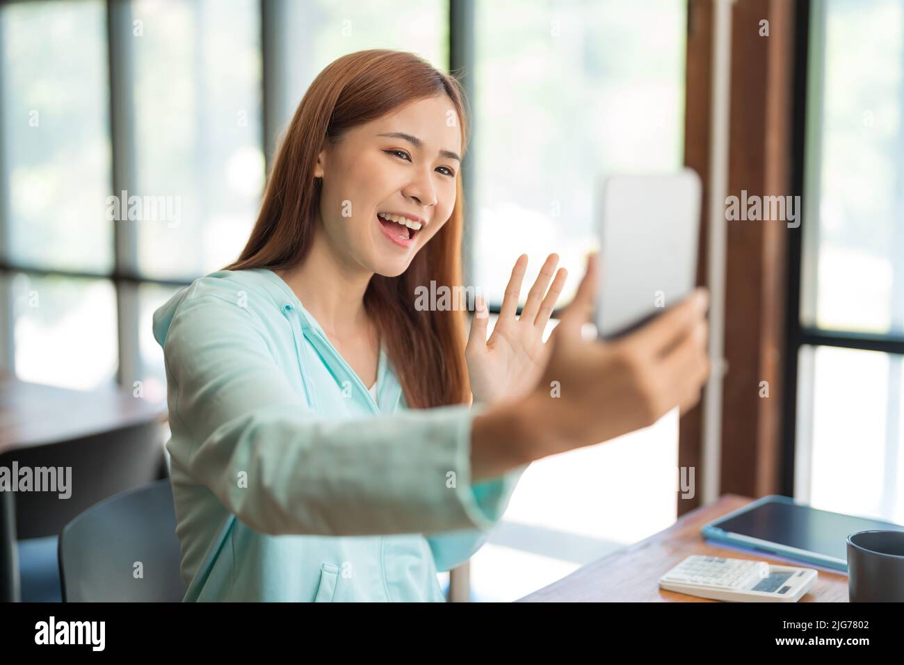 Education concept, Teenage girl using smartphone to video call with ...