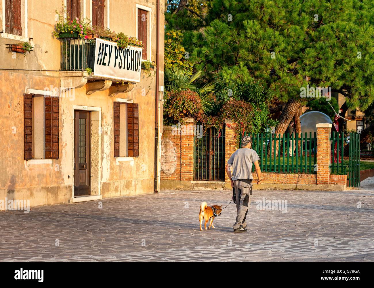 Man walking his dog, Venice, Italy Stock Photo - Alamy