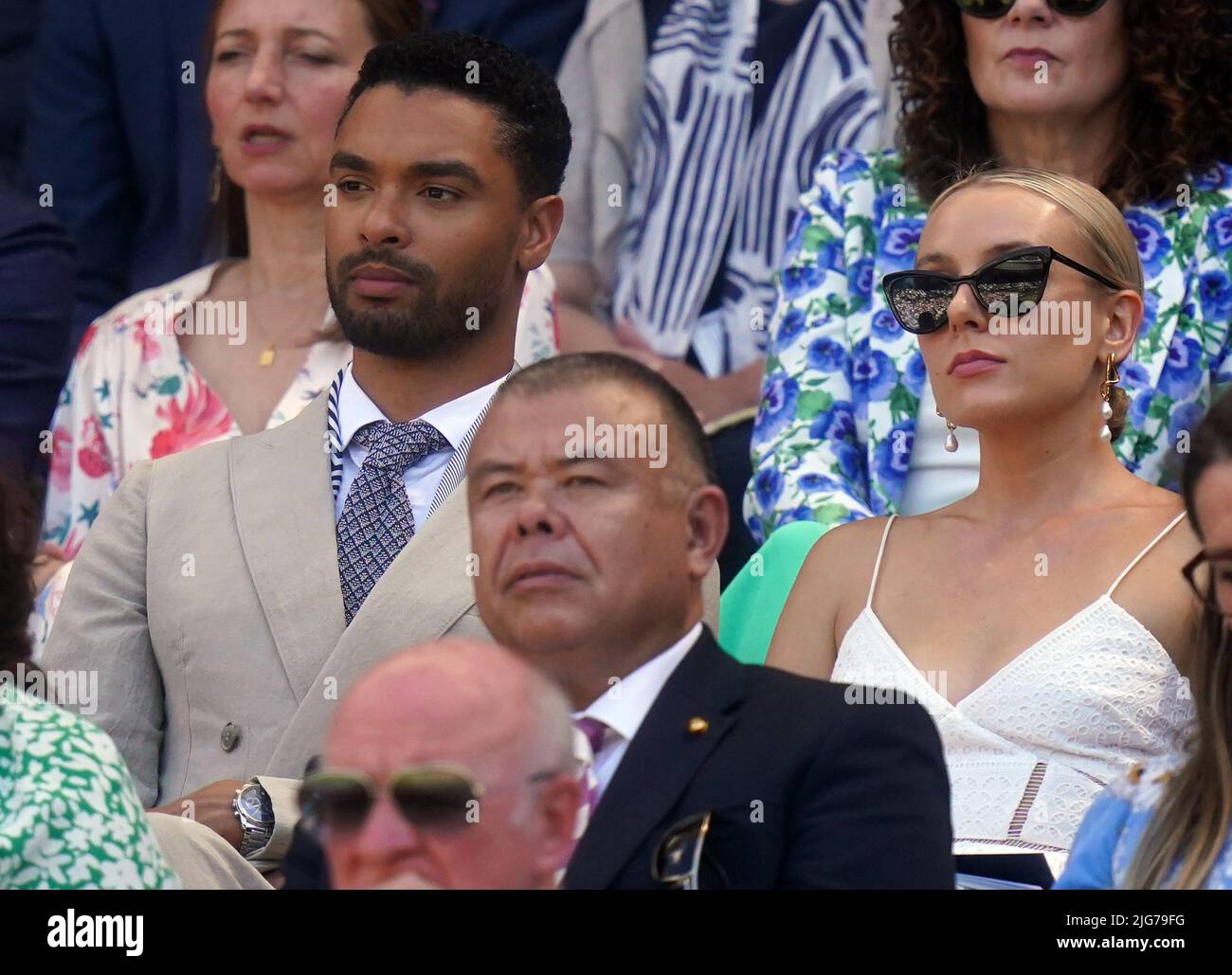 Rege-Jean Page and Emily Brown seated behind and Professor Sir Jonathan ...