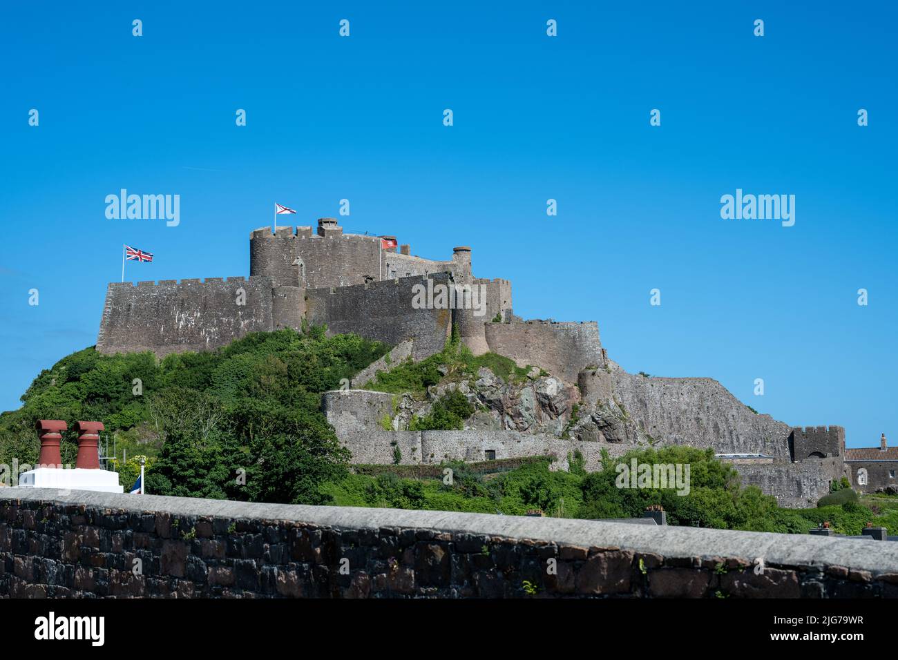 The iconic EMont Orgueil Castle guarding the entrance to Gorey harbour ...
