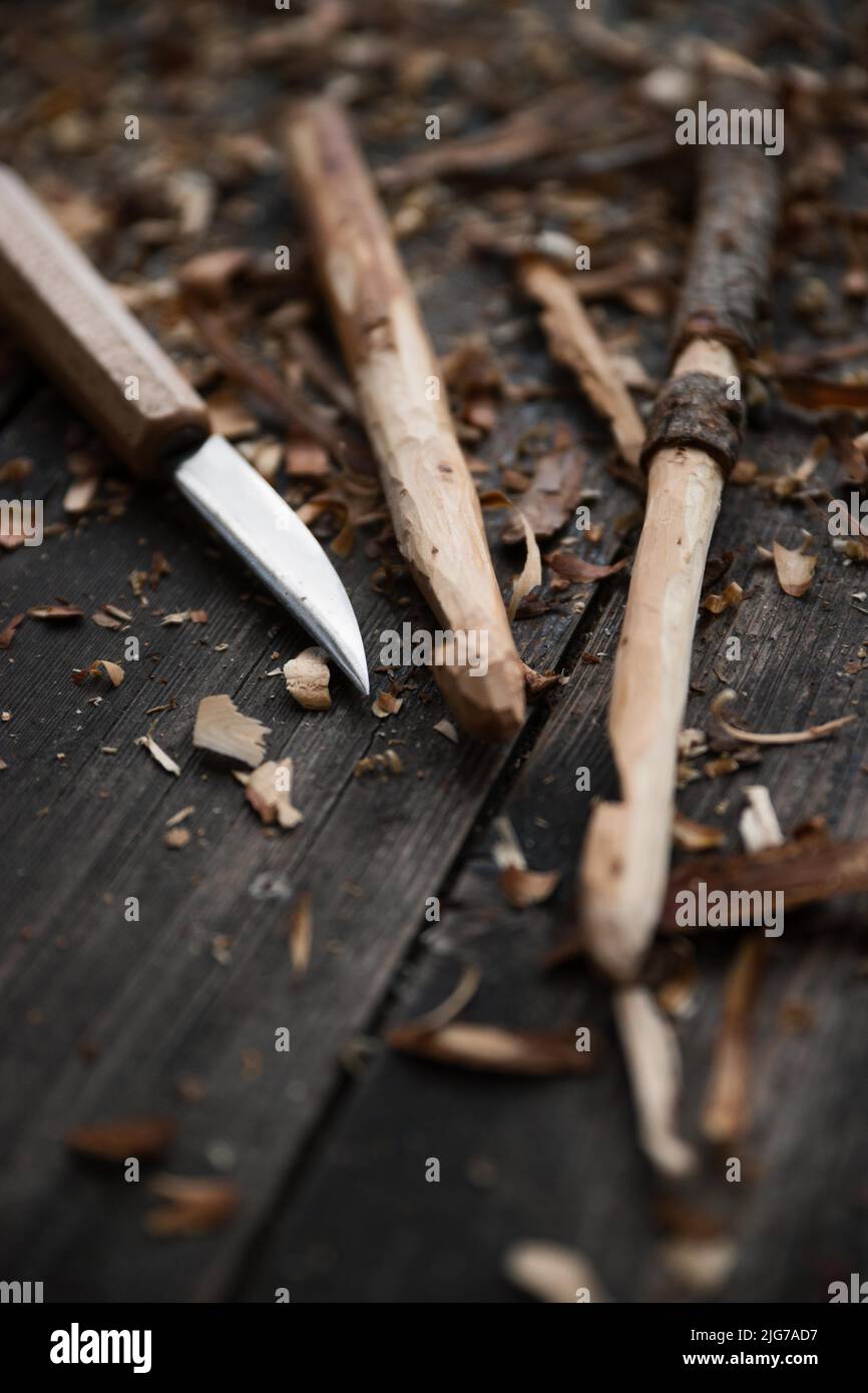 Carved crochet hook, carving knife and wood shavings Stock Photo - Alamy