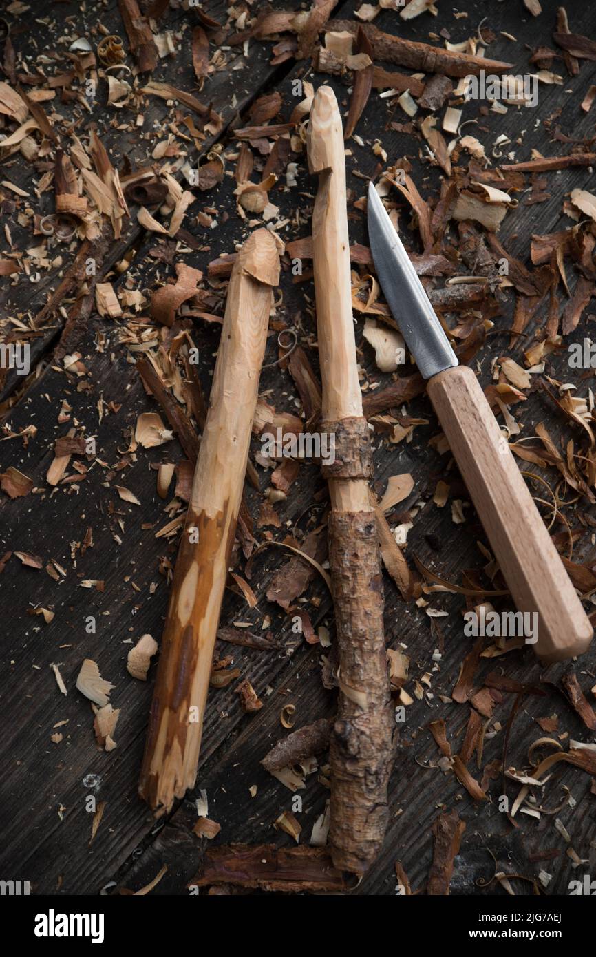 Carved crochet hook, carving knife and wood shavings Stock Photo - Alamy