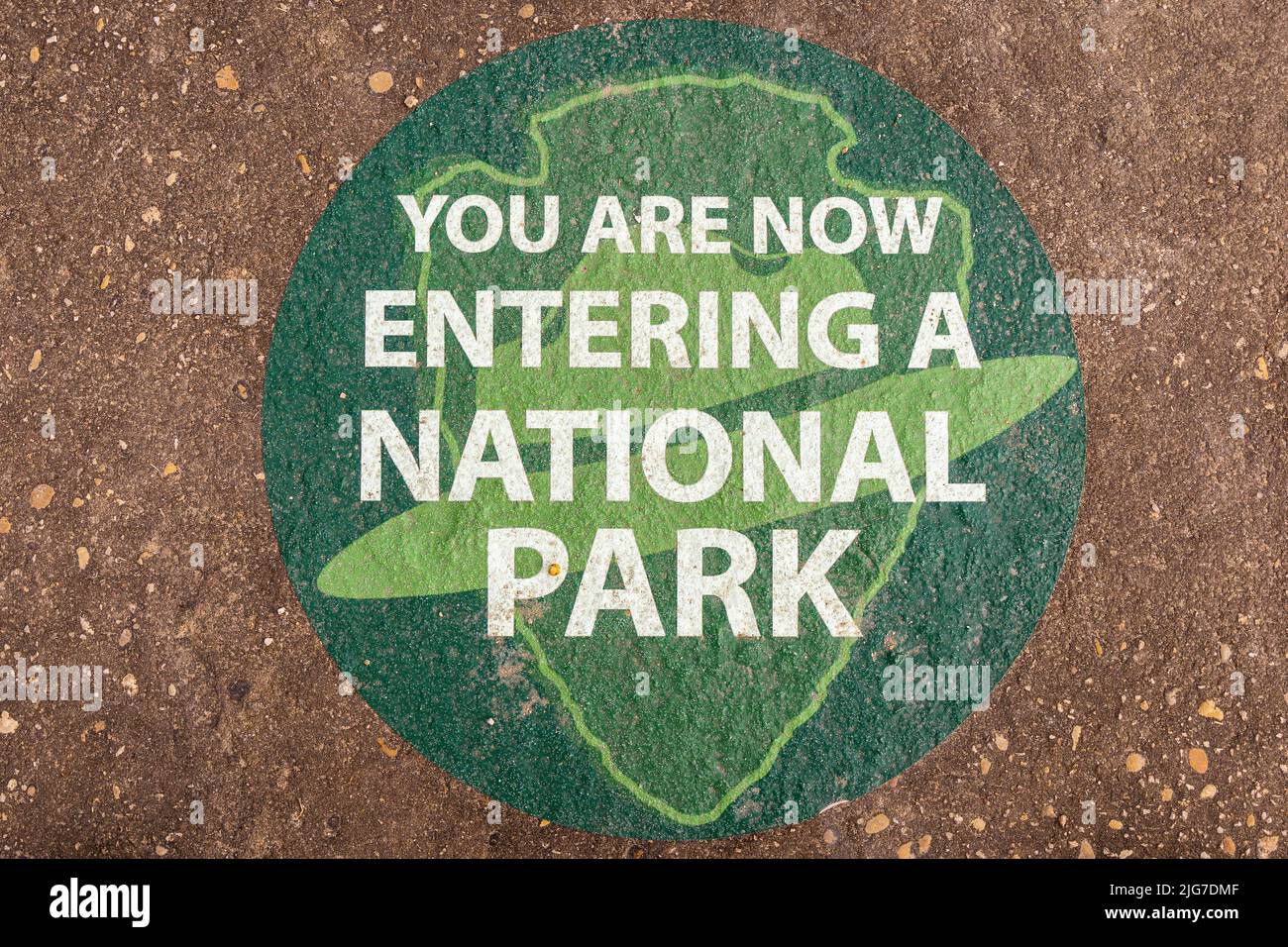 You Are Now Entering A National Park Sign has been painted in green ...