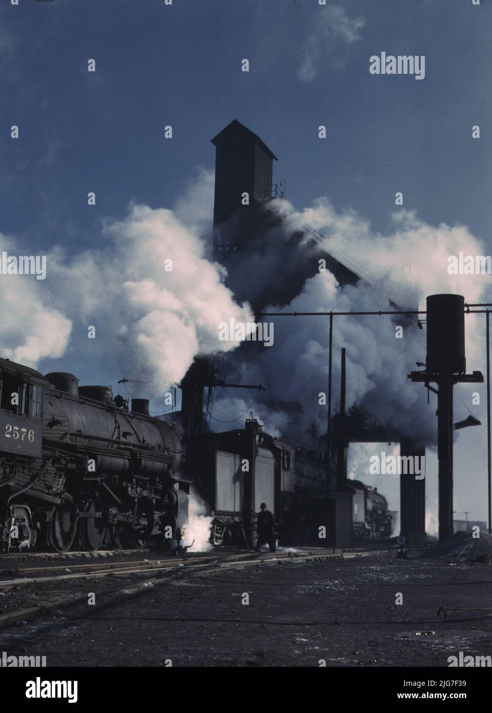 Locomotives over the ash pit at the roundhouse and coaling station at ...
