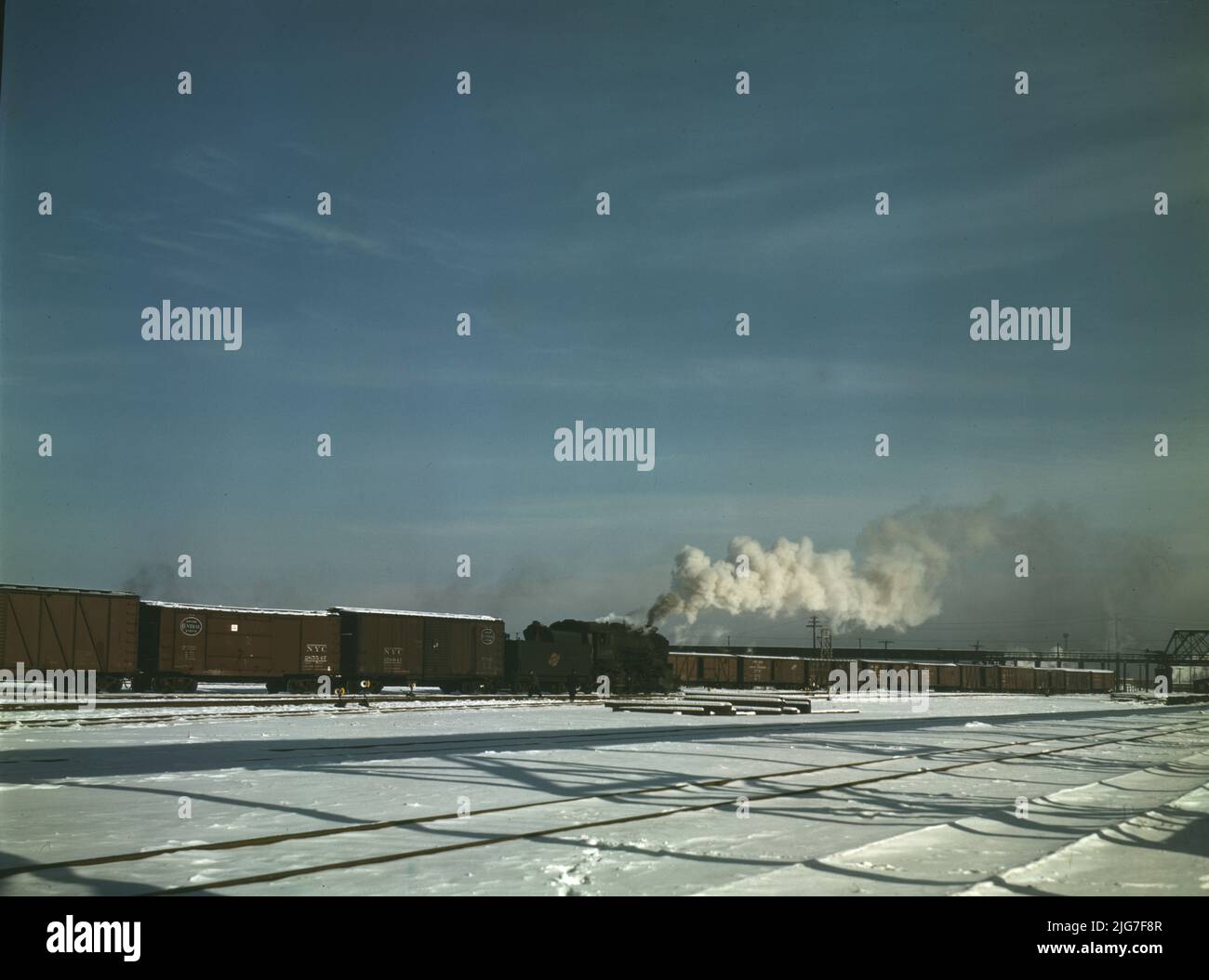 A train pulling out of the freight house at C & NW RR's Proviso(?) yard ...