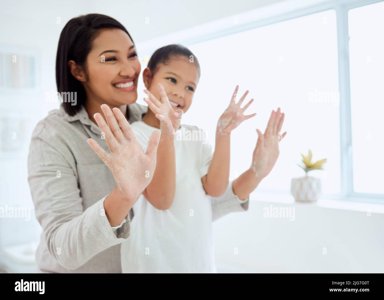 Good hygienic habits starts with clean hands. Shot of an adorable ...