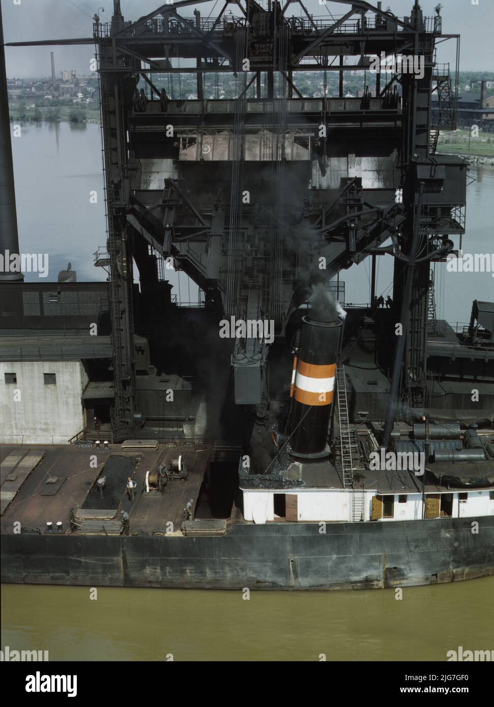 Loading coal into a lake freighter at the Pennsylvania Railroad docks ...