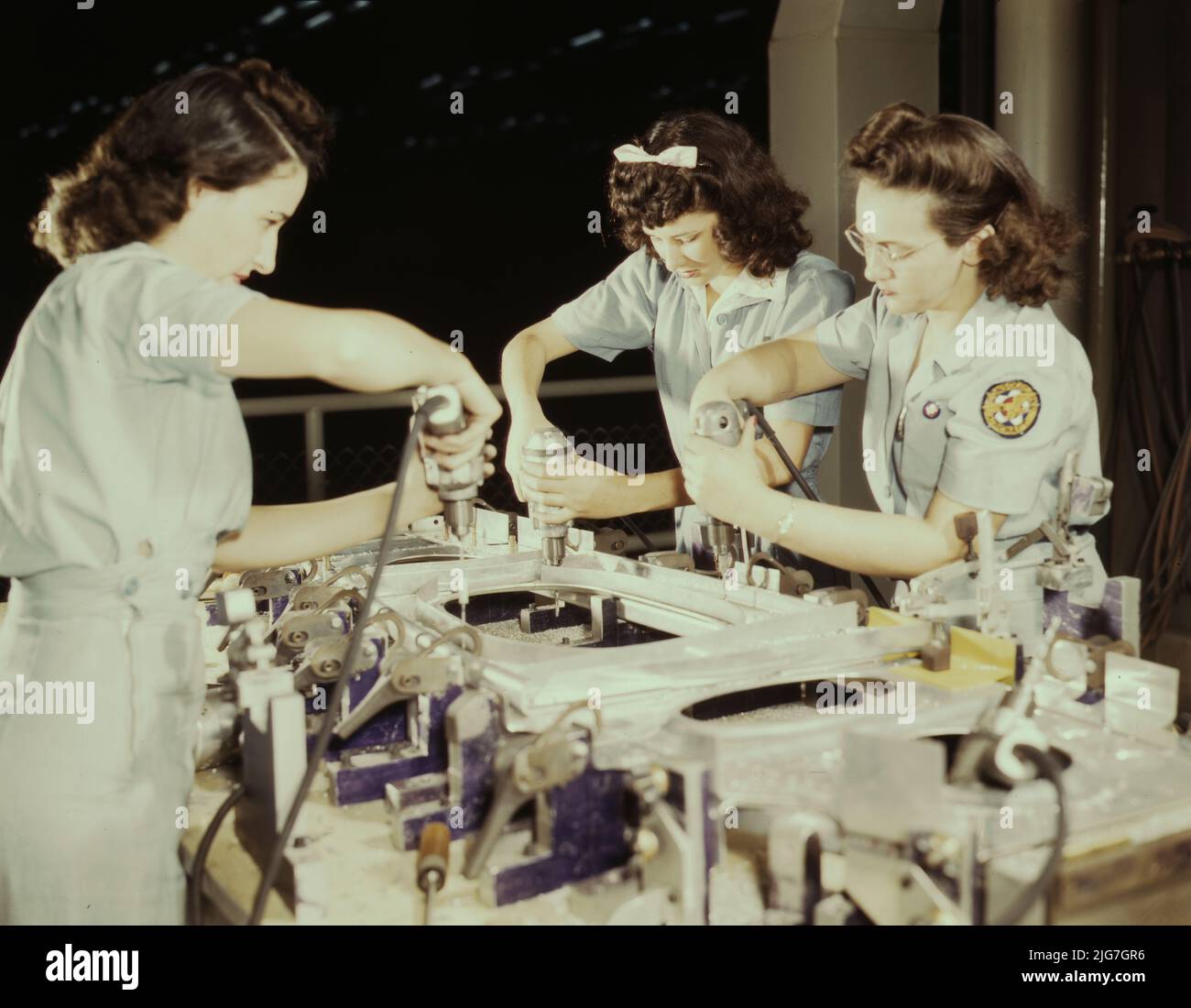 Drilling a wing bulkhead for a transport plane at the Consolidated ...