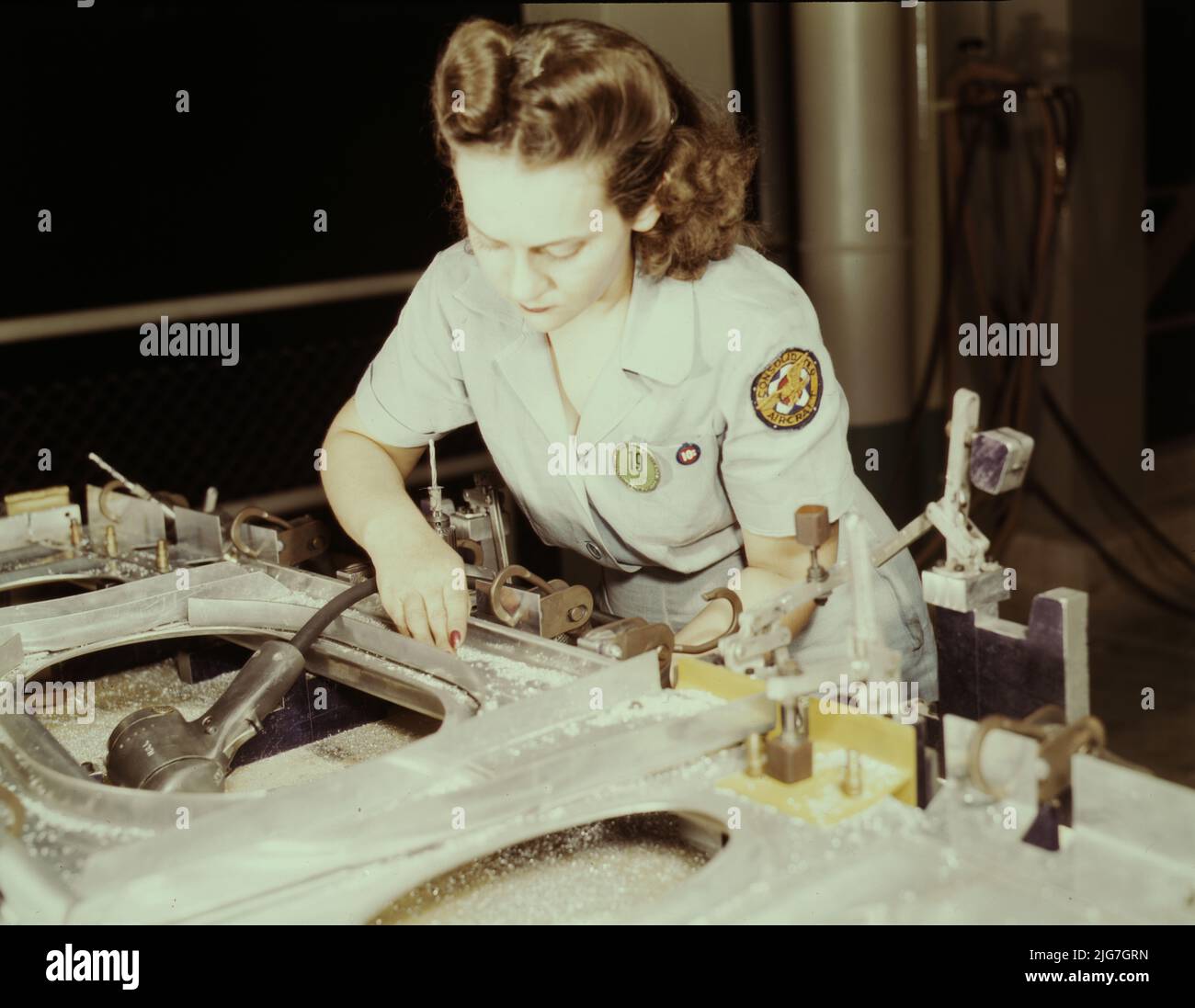 Drilling a wing bulkhead for a transport plane at the Consolidated ...
