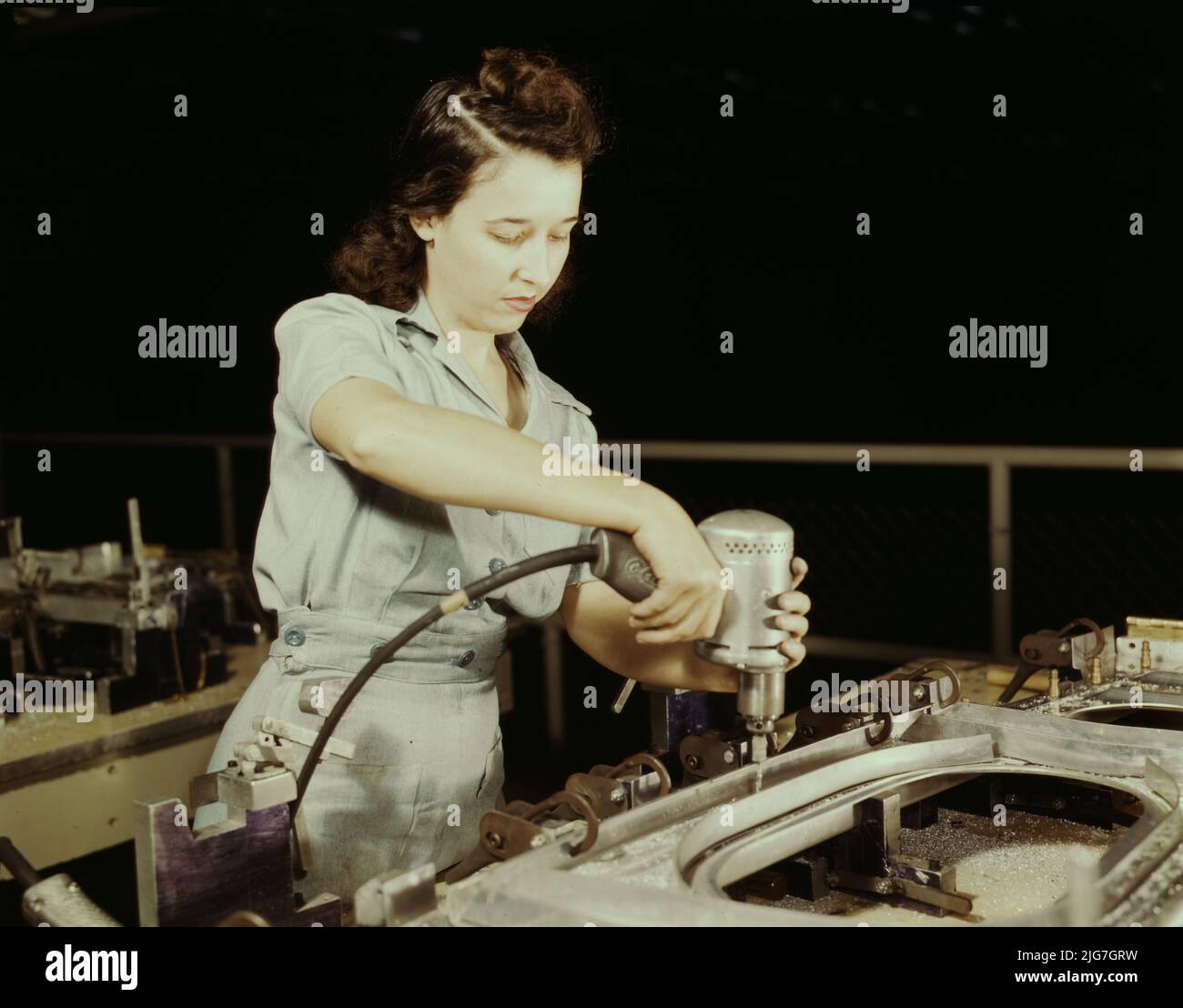 Drilling a wing bulkhead for a transport plane at the Consolidated ...