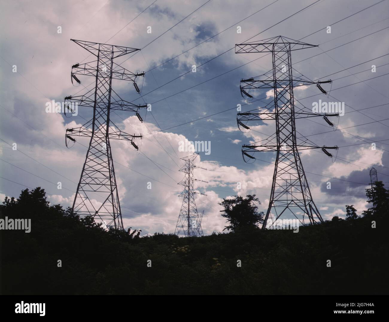 Transmission line towers and high tension lines that carry current ...