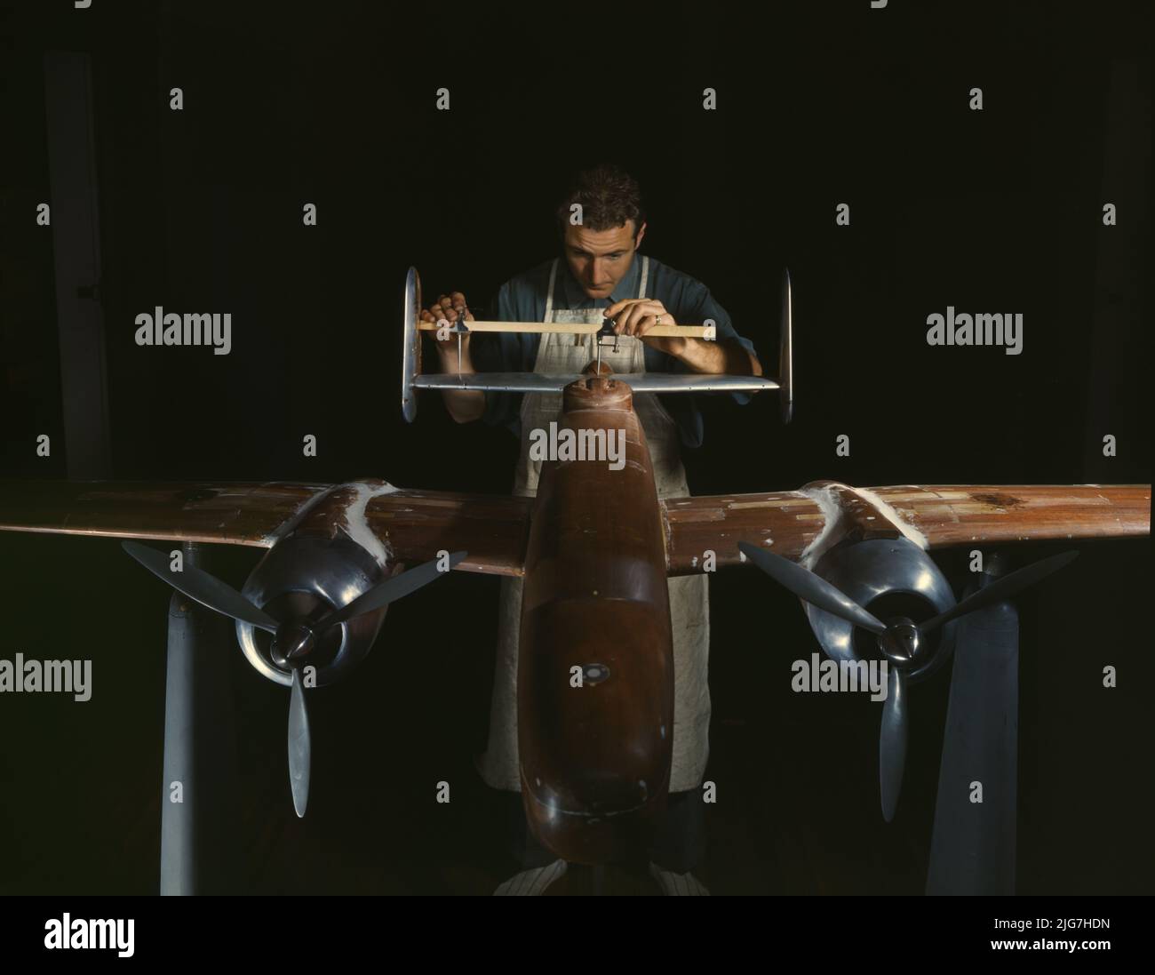 An experimental scale model of the B-25 plane is prepared for wind ...
