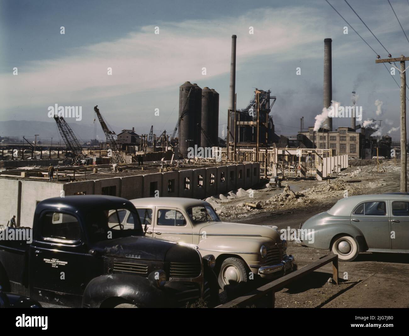 Steel and concrete go into place rapidly as a new steel mill takes form ...