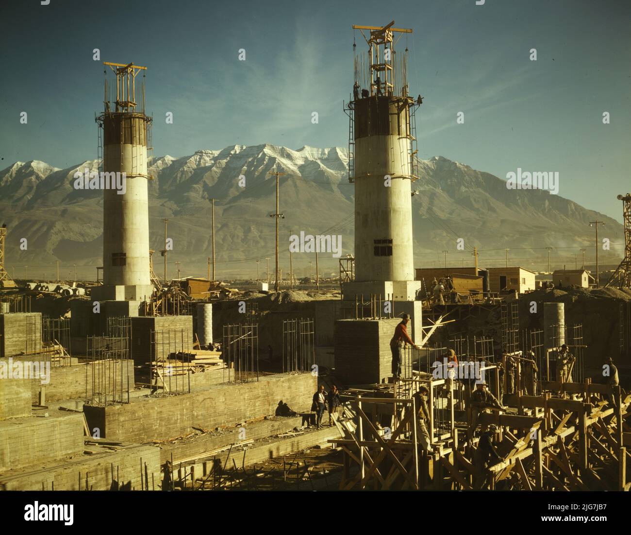 Partly finished open hearth furnaces and stacks for a steel mill under ...